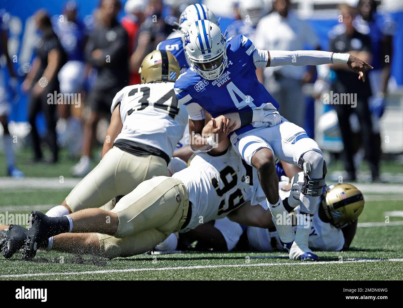 Georgia State quarterback Cornelious Brown IV (4) is tackled by Army ...