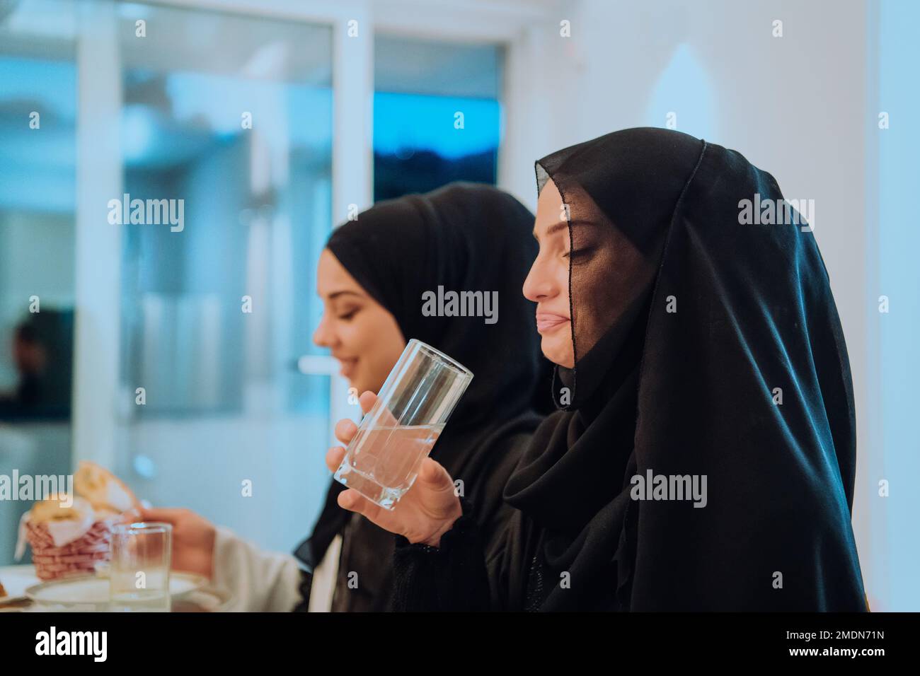 Eid Mubarak Muslim family having Iftar dinner drinking water to break ...