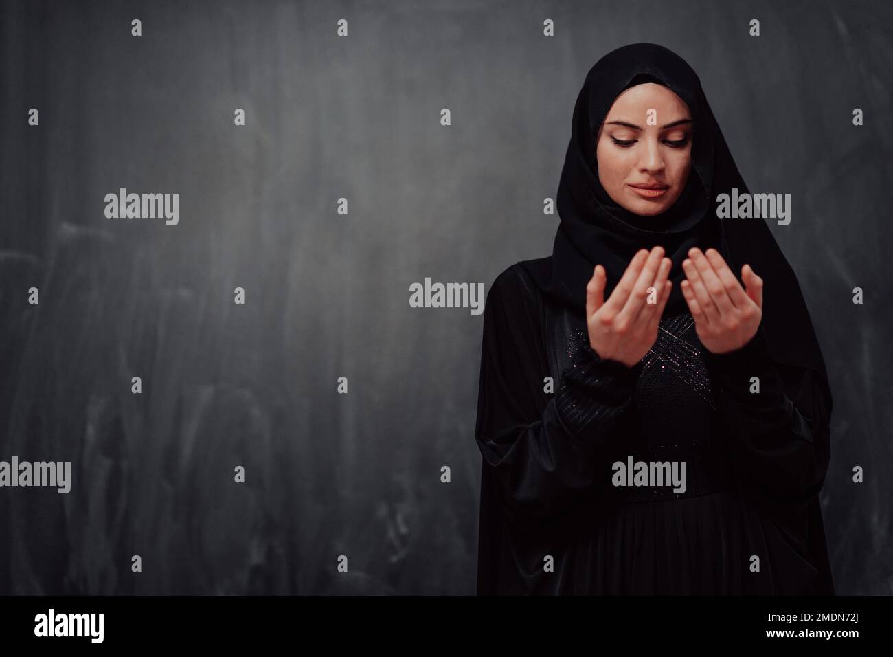 Portrait of young Muslim woman making dua Stock Photo - Alamy
