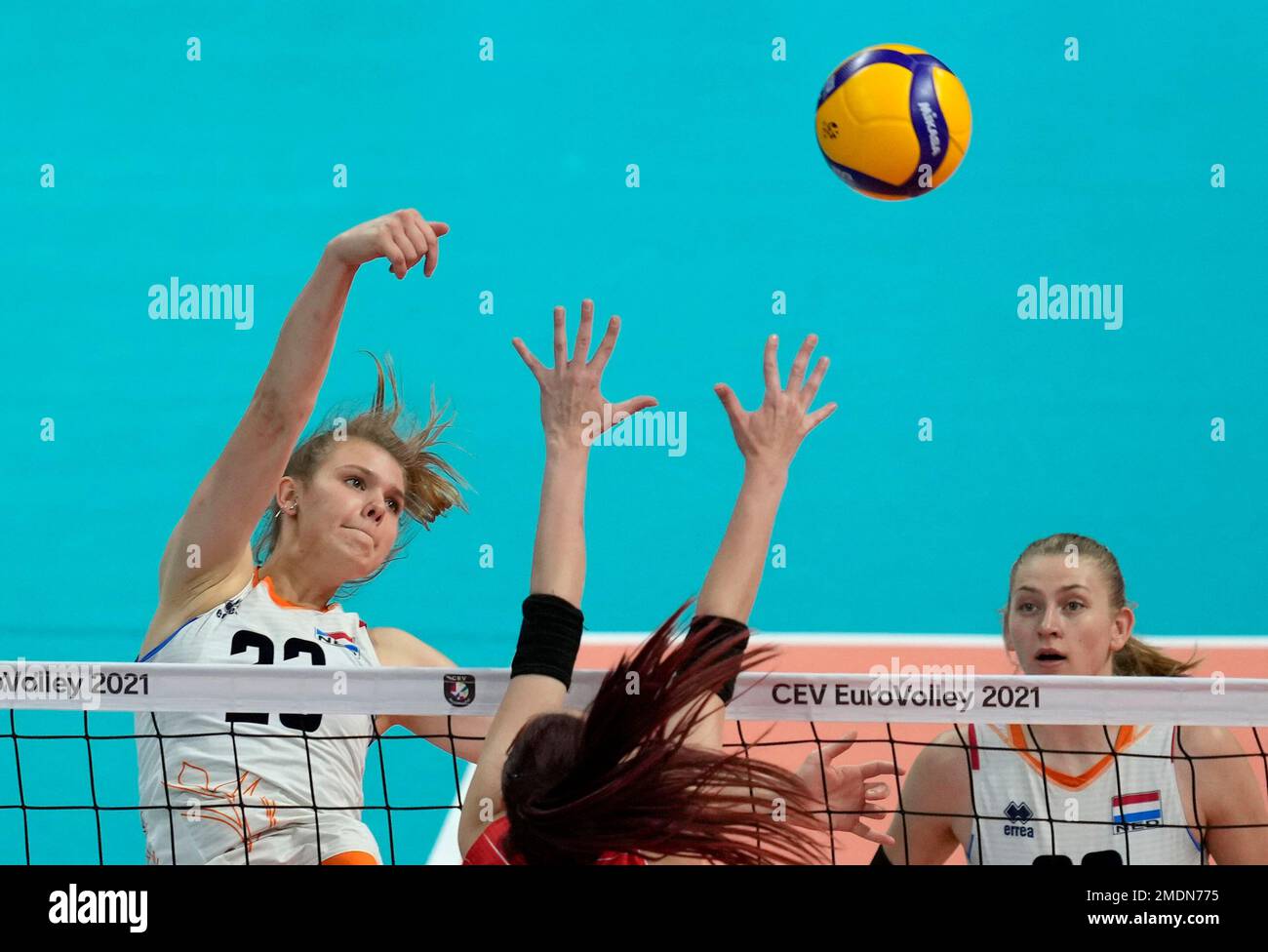 Netherlands' Eline Timmerman, left, spikes the ball against Turkey's ...