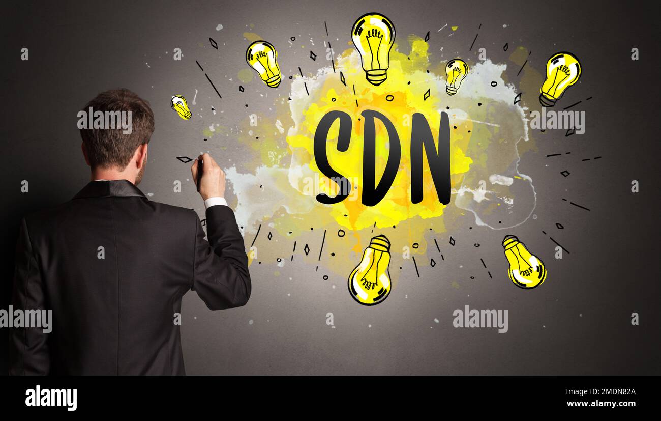 man drawing colorful light bulb Stock Photo - Alamy