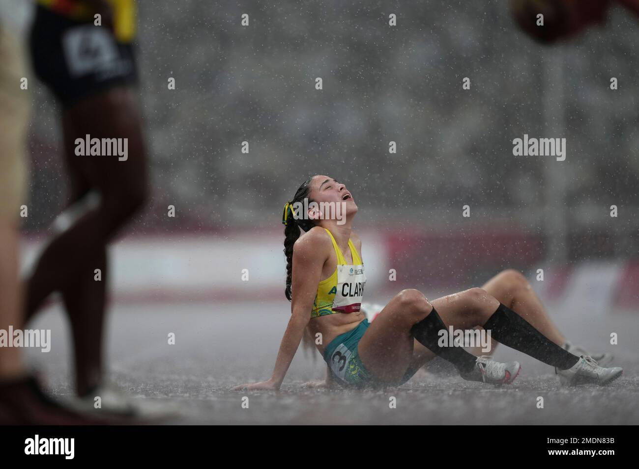 Australia's Rhiannon Clarke reacts in the rain after the women's T38 ...