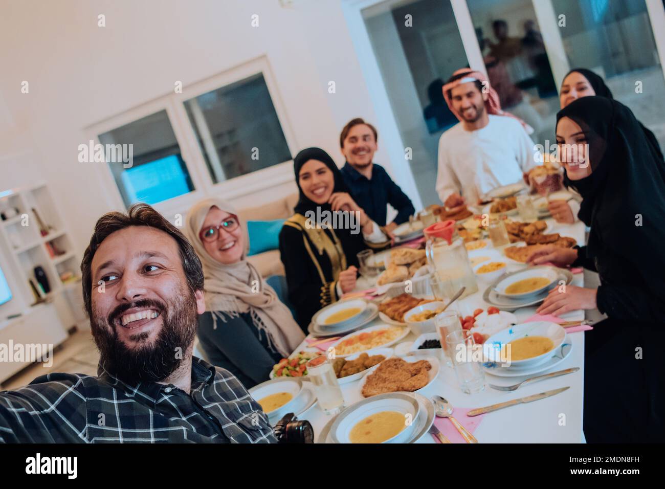 Eid Mubarak Muslim family having Iftar dinner taking pictures with ...