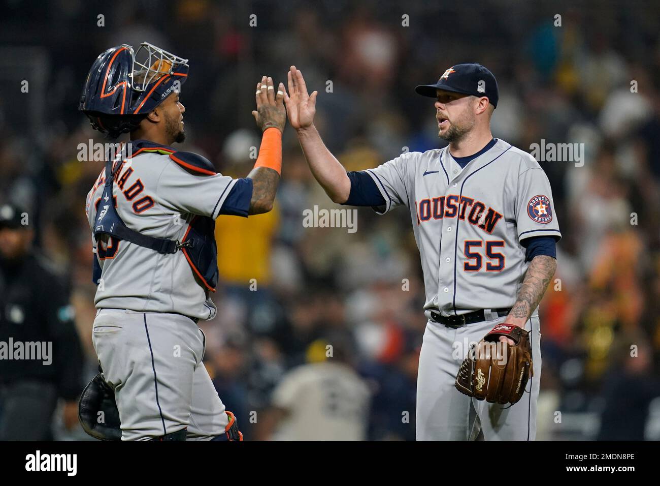 Houston Astros relief pitcher Ryan Pressly (55) celebrates with catcher ...