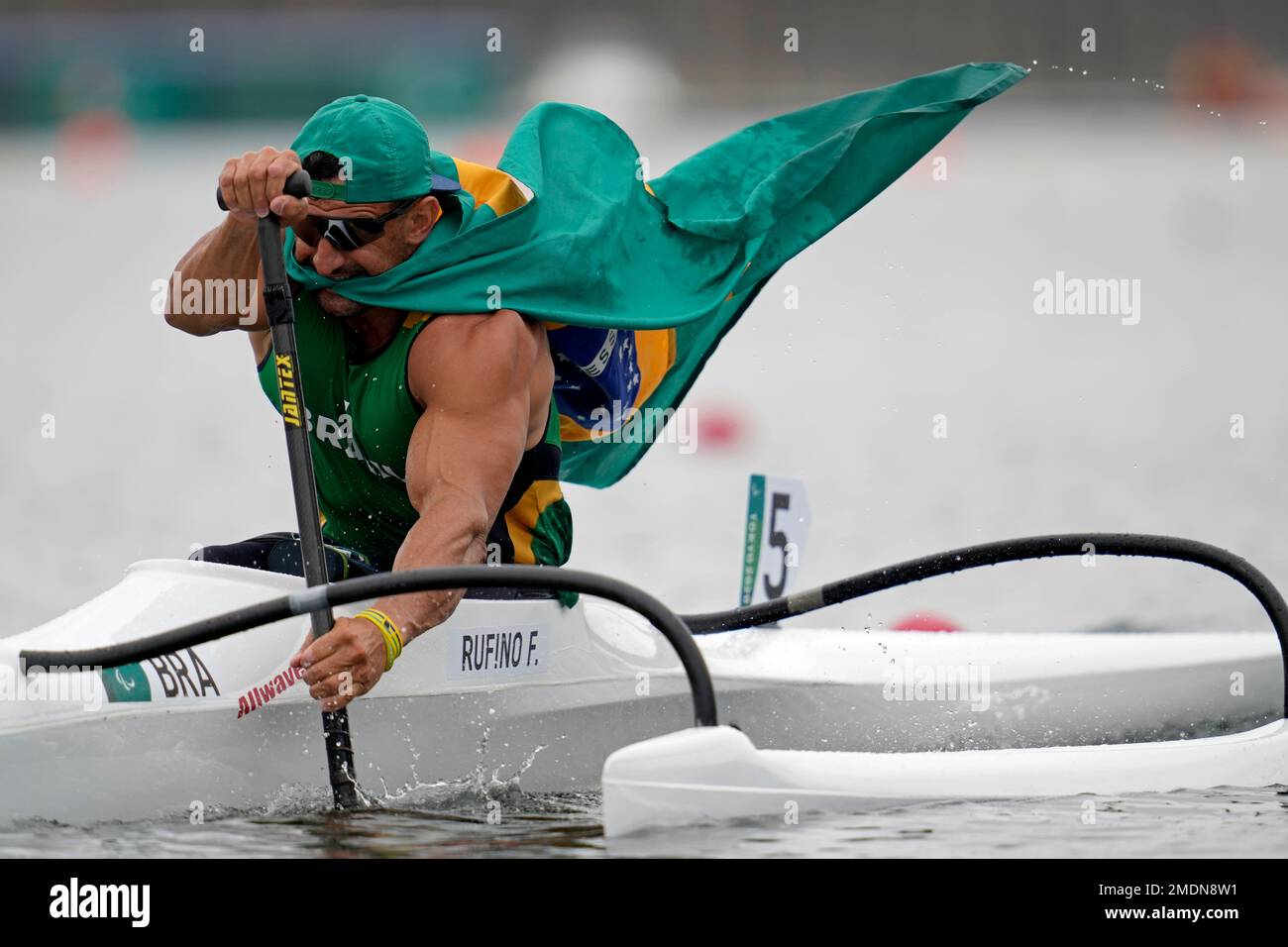 Brazil's Fernando Rufino de Paulo celebrates with his national flag ...