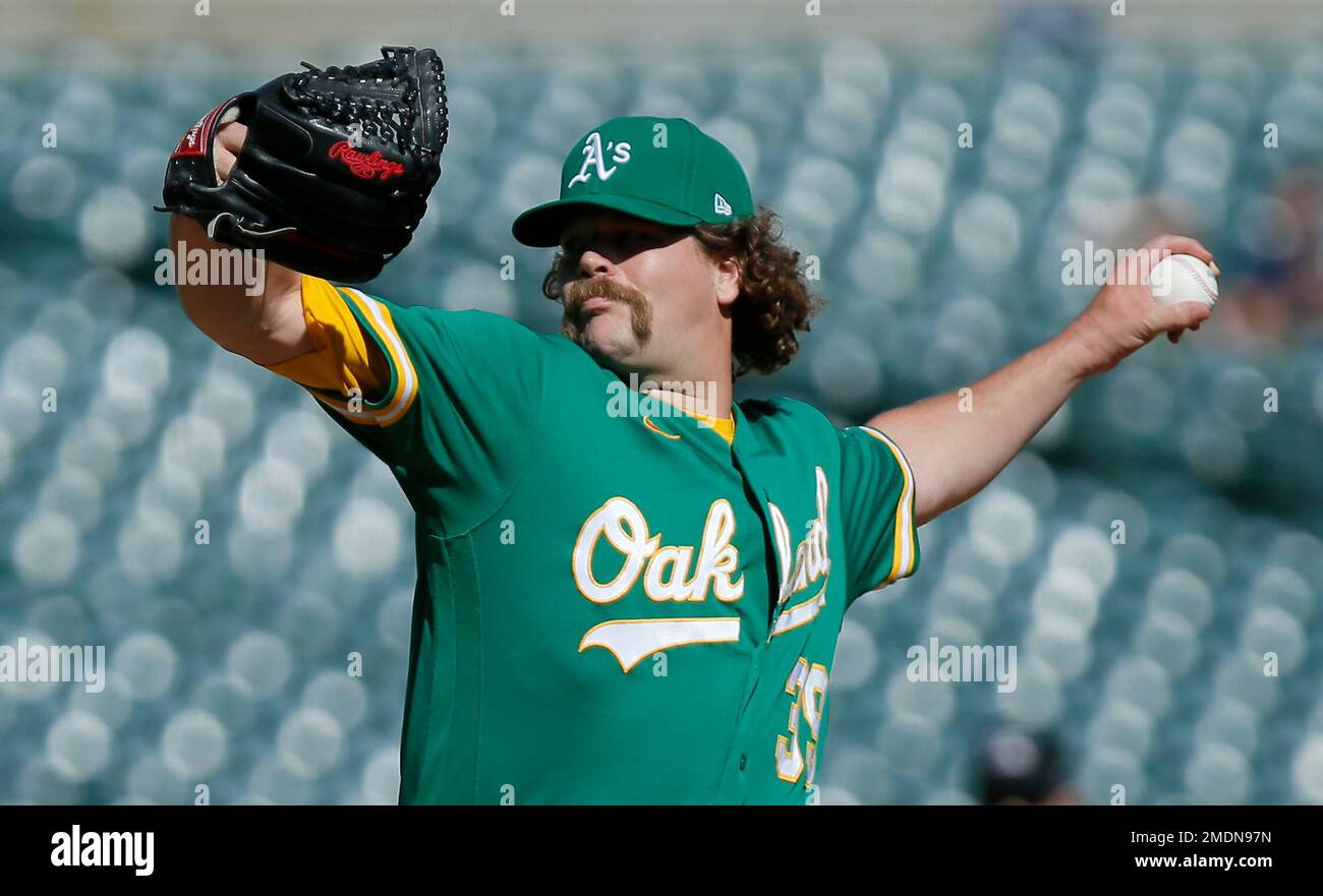 Oakland Athletics relief pitcher Andrew Chafin (39) delivers against ...