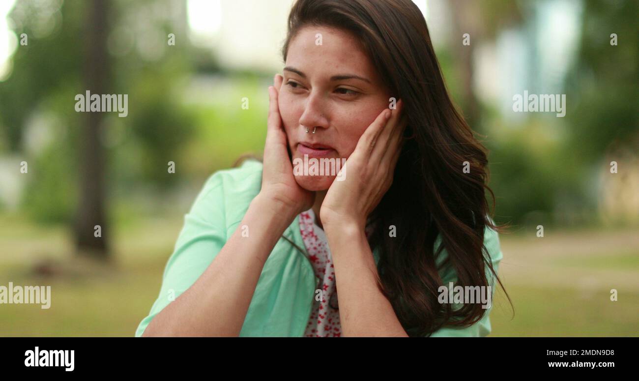 Woman feeling jaw pain gesturing scretching face Stock Photo - Alamy