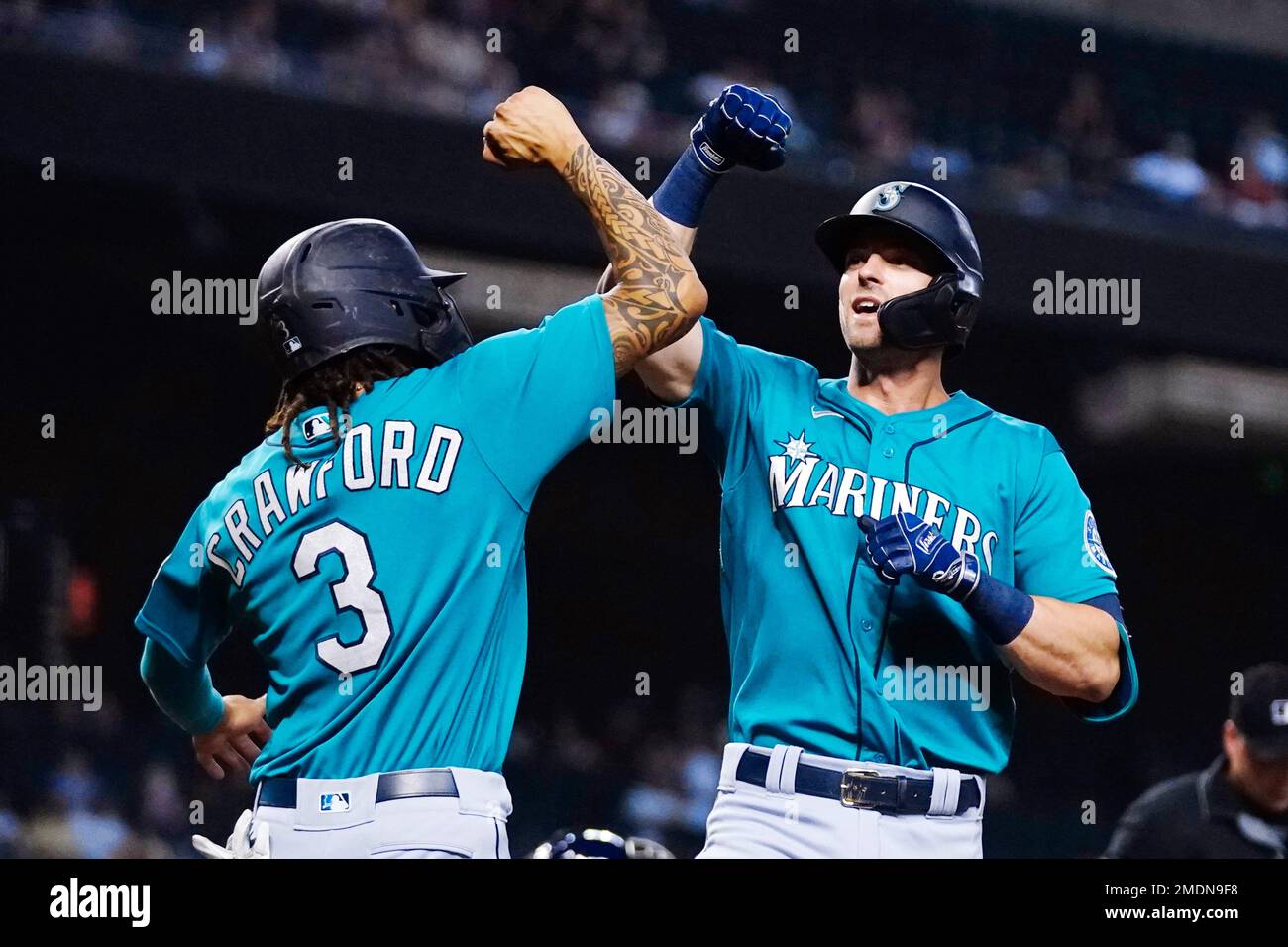 Seattle Mariners' Mitch Haniger, right, celebrates his two-run home run ...