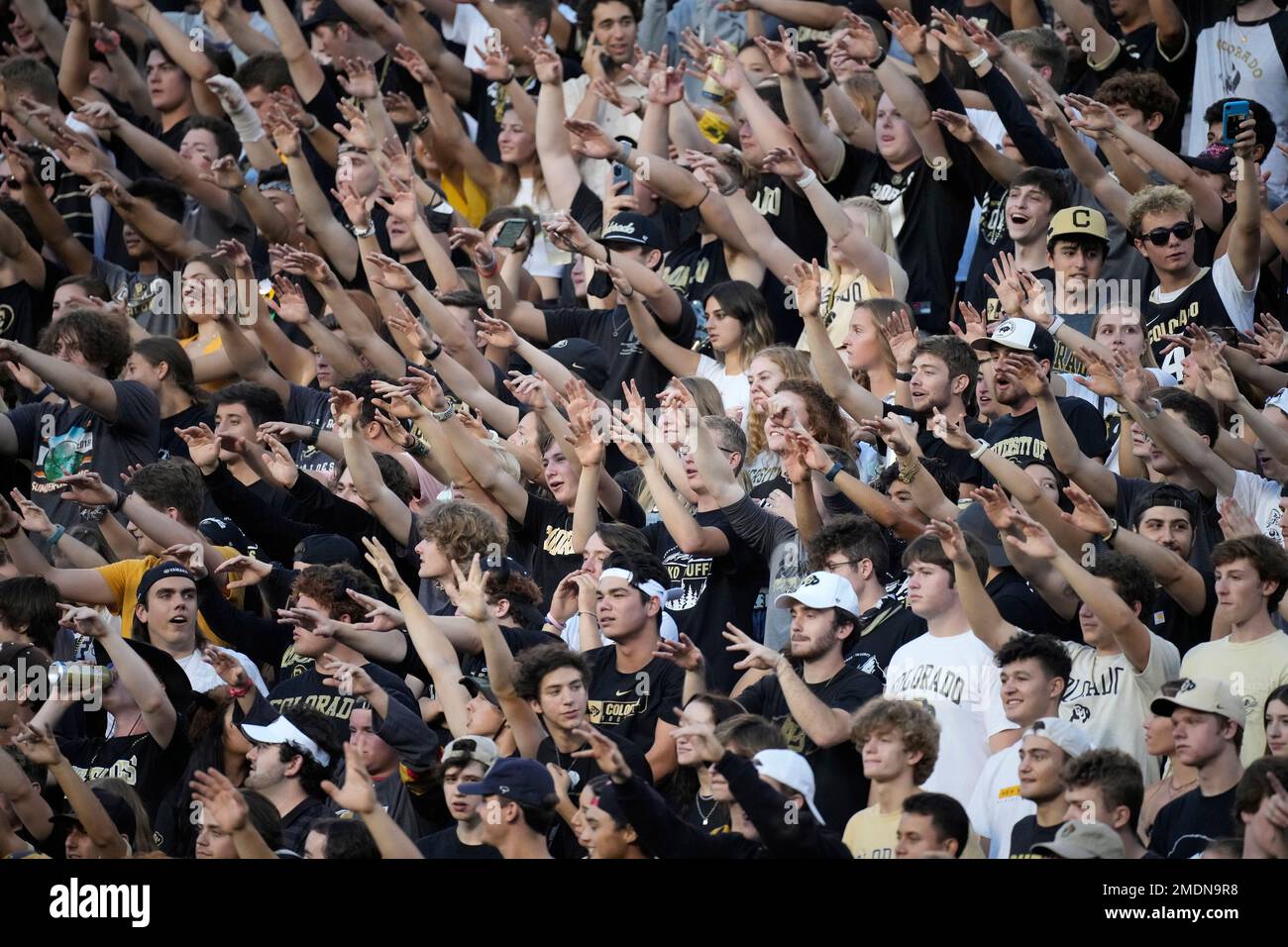 Fans cheer as the football is kicked by Colorado to Northern Colorado ...