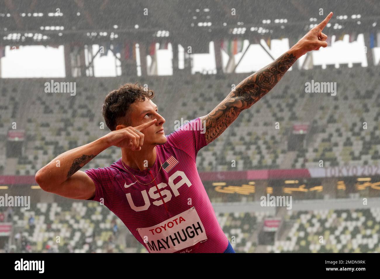 United States' Nick Mayhugh celebrates after winning the men's T37 200 ...