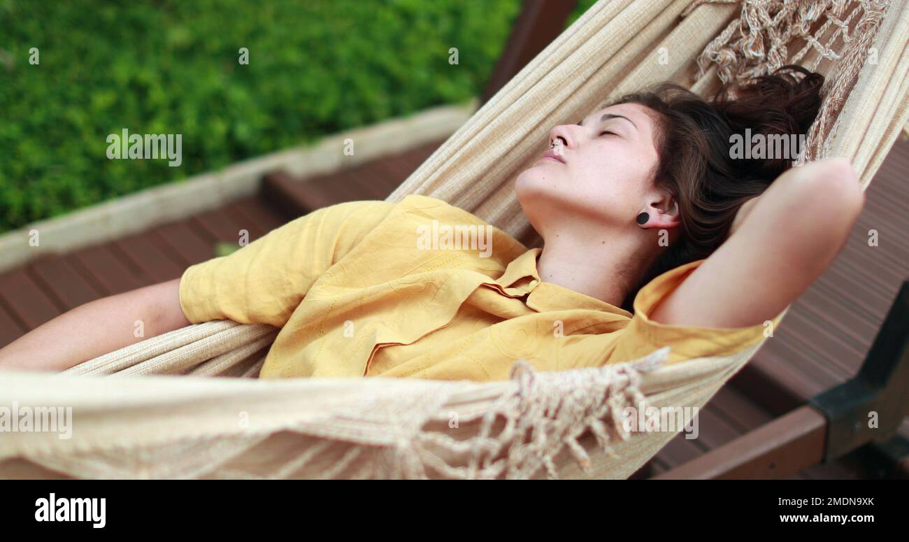 Attractive girl relaxing on hammock hi-res stock photography and images ...
