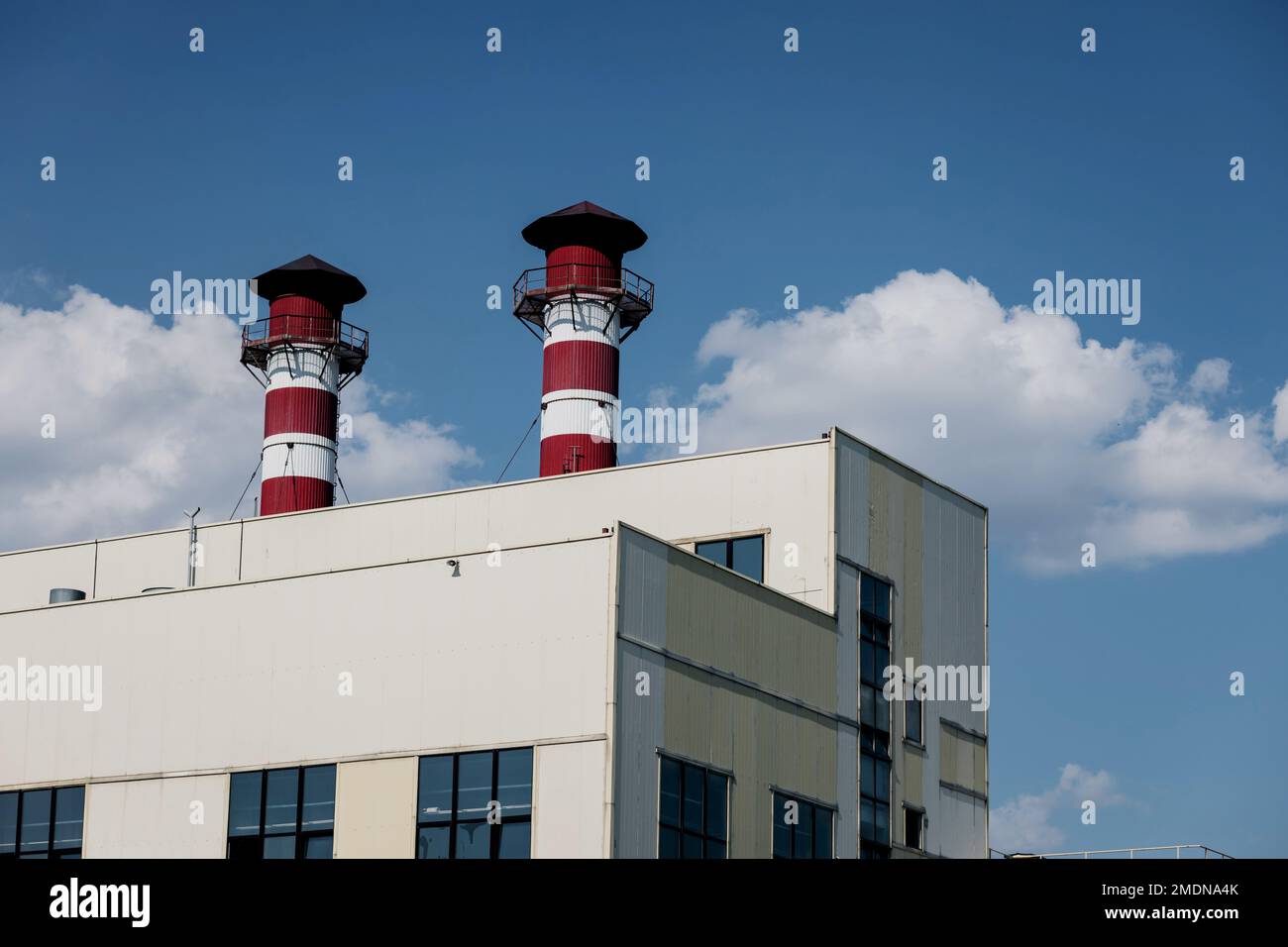 industrial warehouse or production building with large pipes. exterior ...