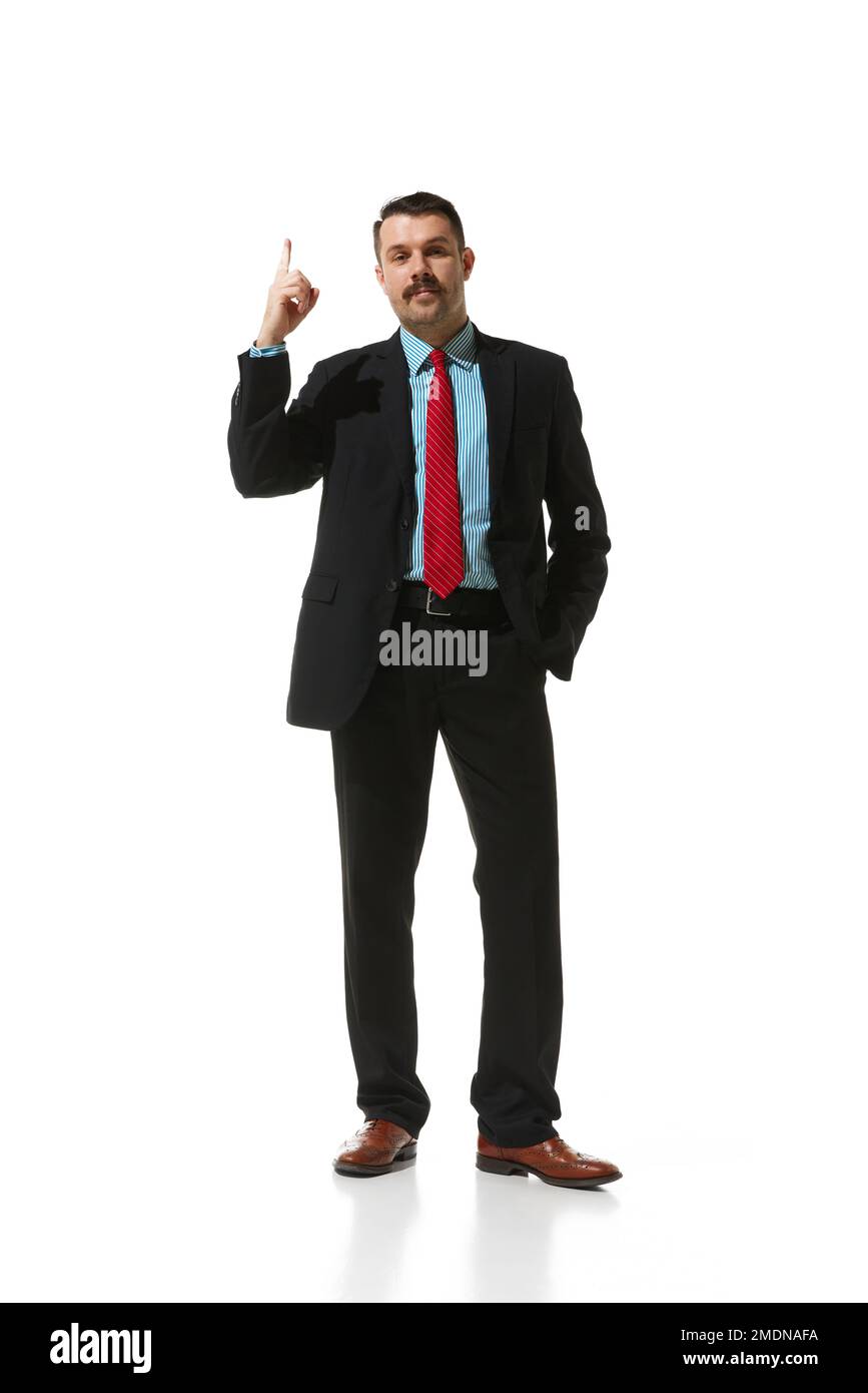 Businessman in a suit raising finger up, having brilliant successful ...