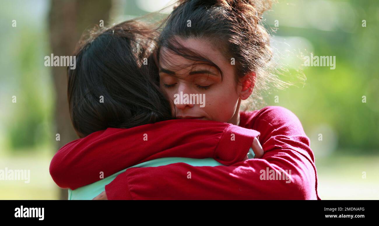 Women hugging each other in empathy. Female friend understanding and ...