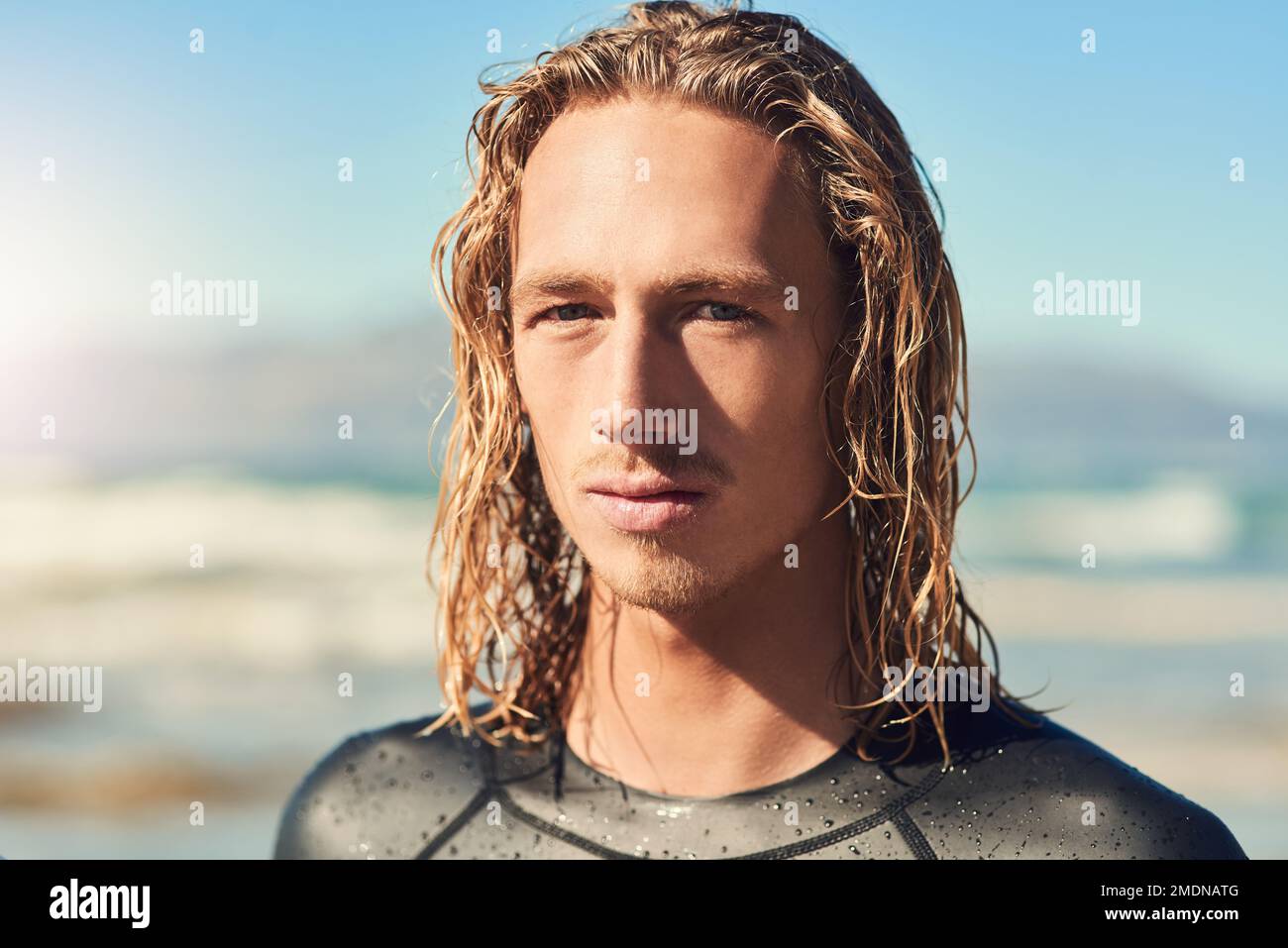 See you at the beach. a handsome young man spending the day on the ...