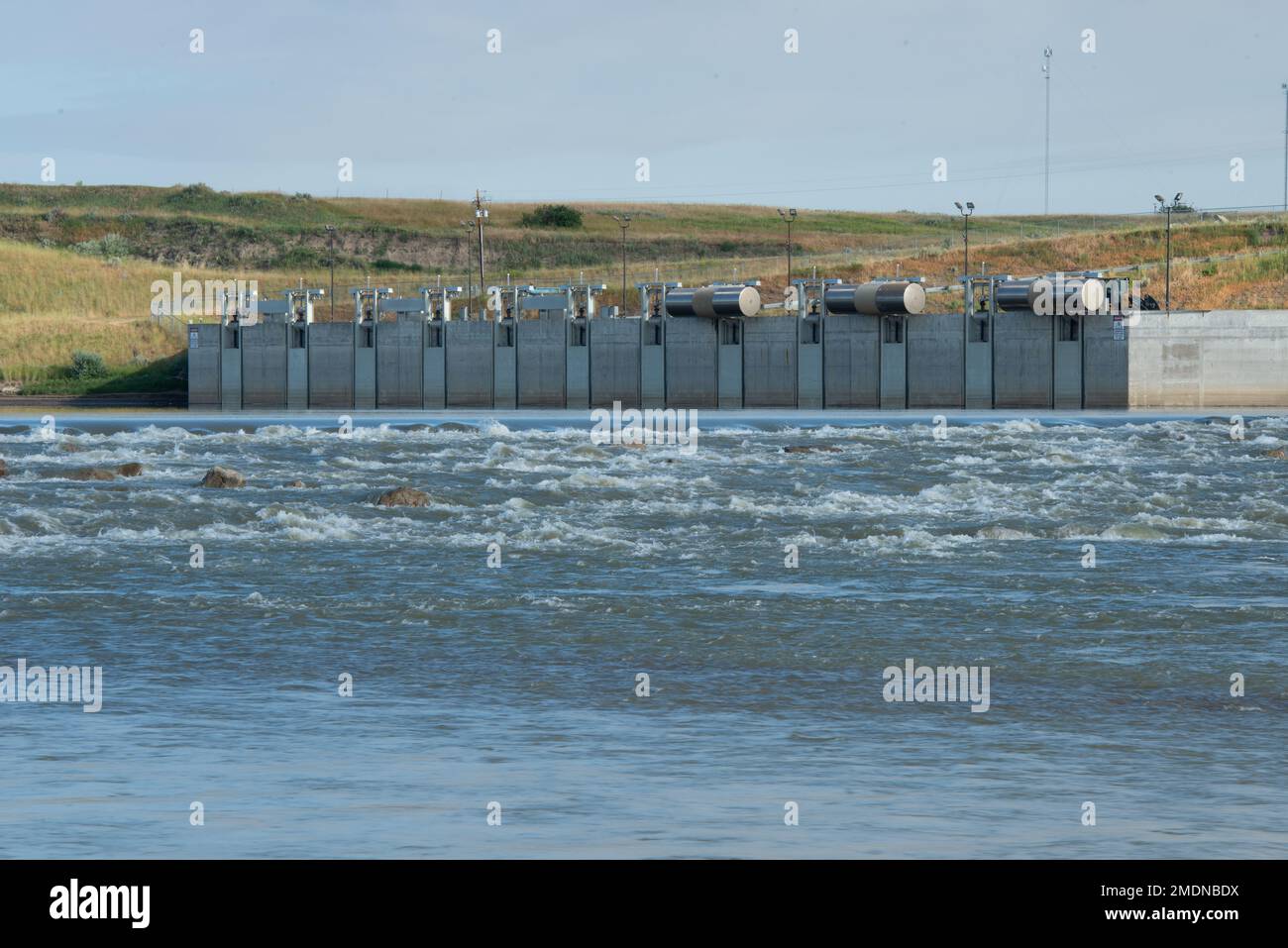Water flows past the Lower Yellowstone intake canal headworks structure ...