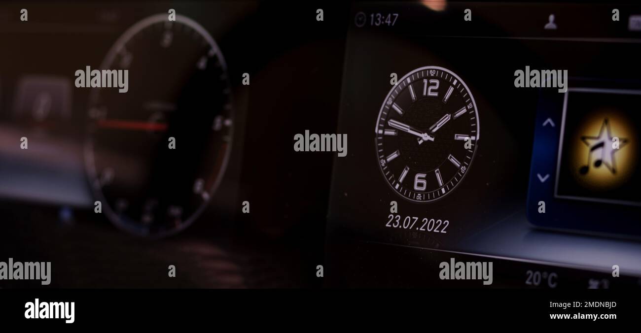 luxury electronic clock on the dashboard of an expensive car Stock ...