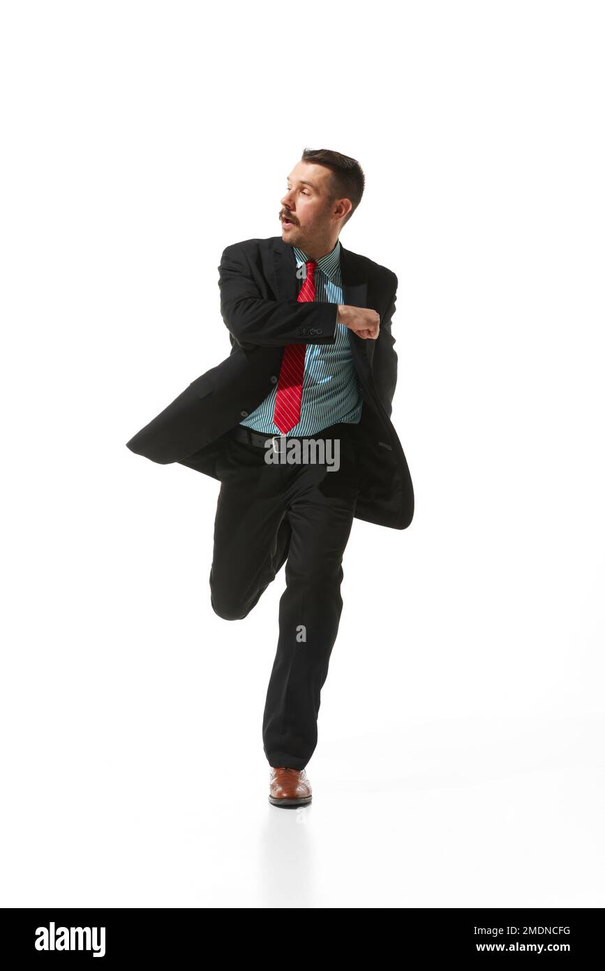 Businessman in a suit with positive mood running to work over white ...