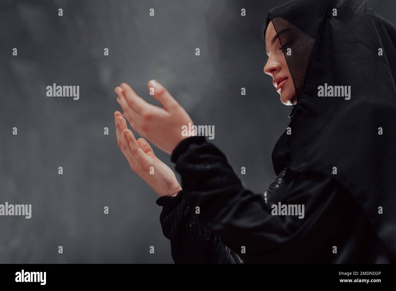 Portrait of young Muslim woman making dua Stock Photo - Alamy