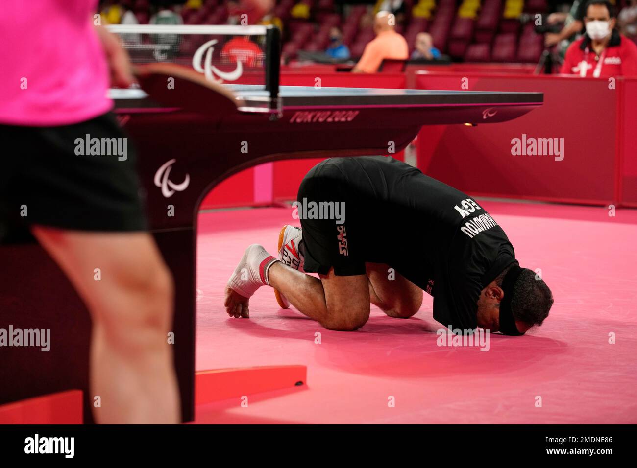 Ibrahim Hamadtou, of Egypt, prays after the competition against Park ...
