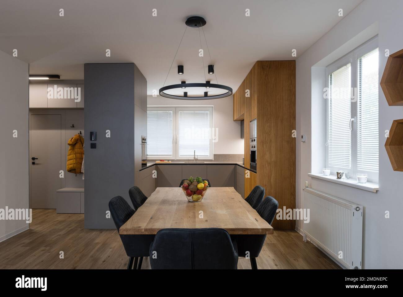 Modern kitchen with built in appliances and dining table Stock Photo ...