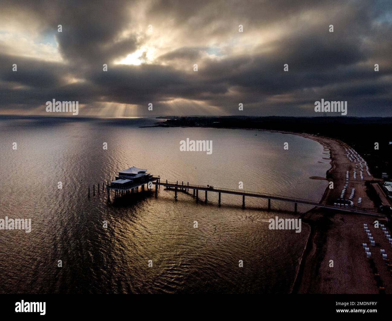 Clouds drift over the pier at the Baltic Sea in Timmendorfer Strand ...