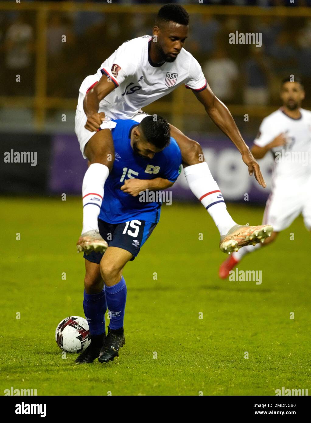 United States' Jordan Pefok, top, and El Salvador's Alex Roldan, fight ...