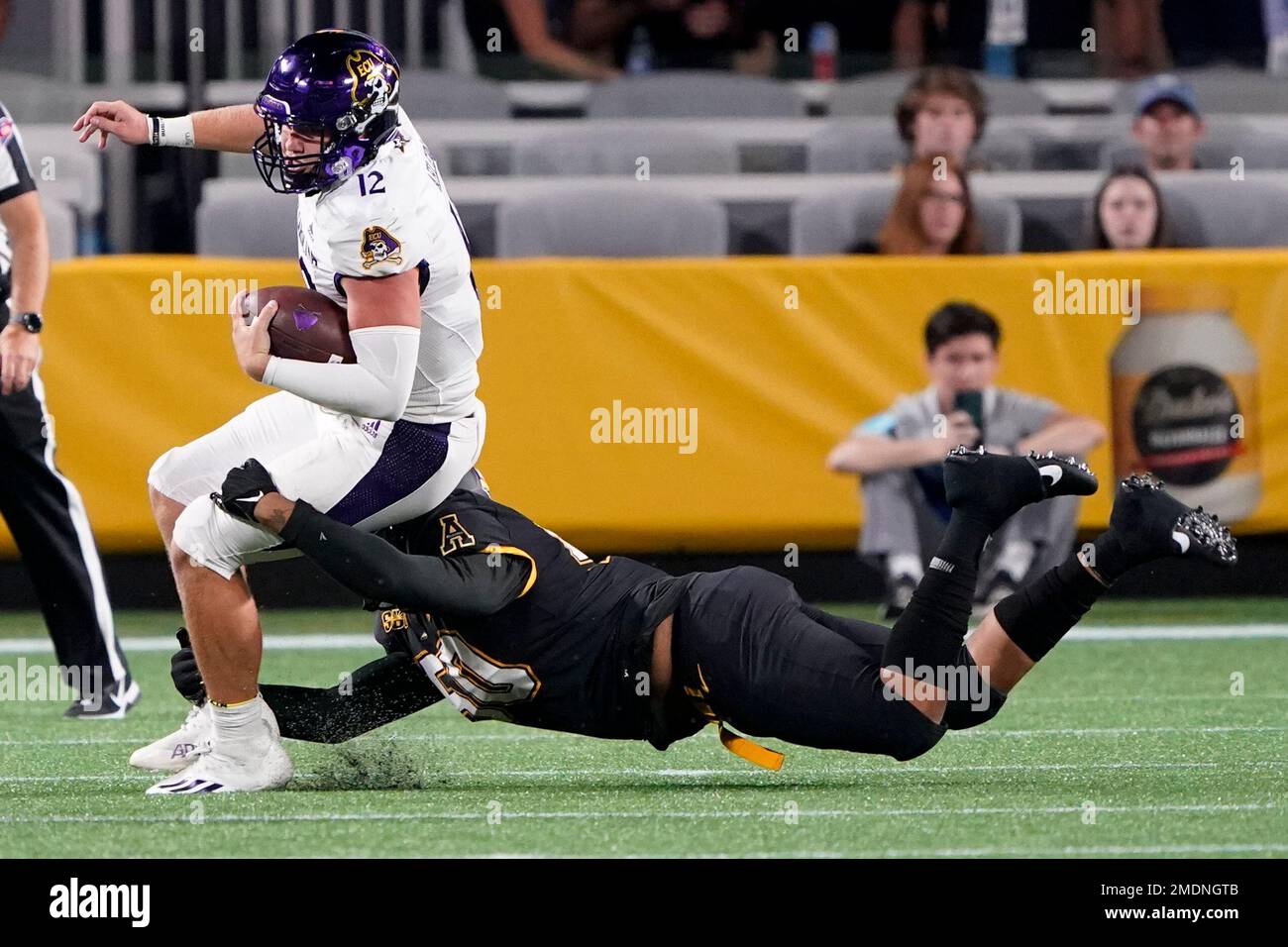 East Carolina quarterback Holton Ahlers is tackled by Appalachian State ...