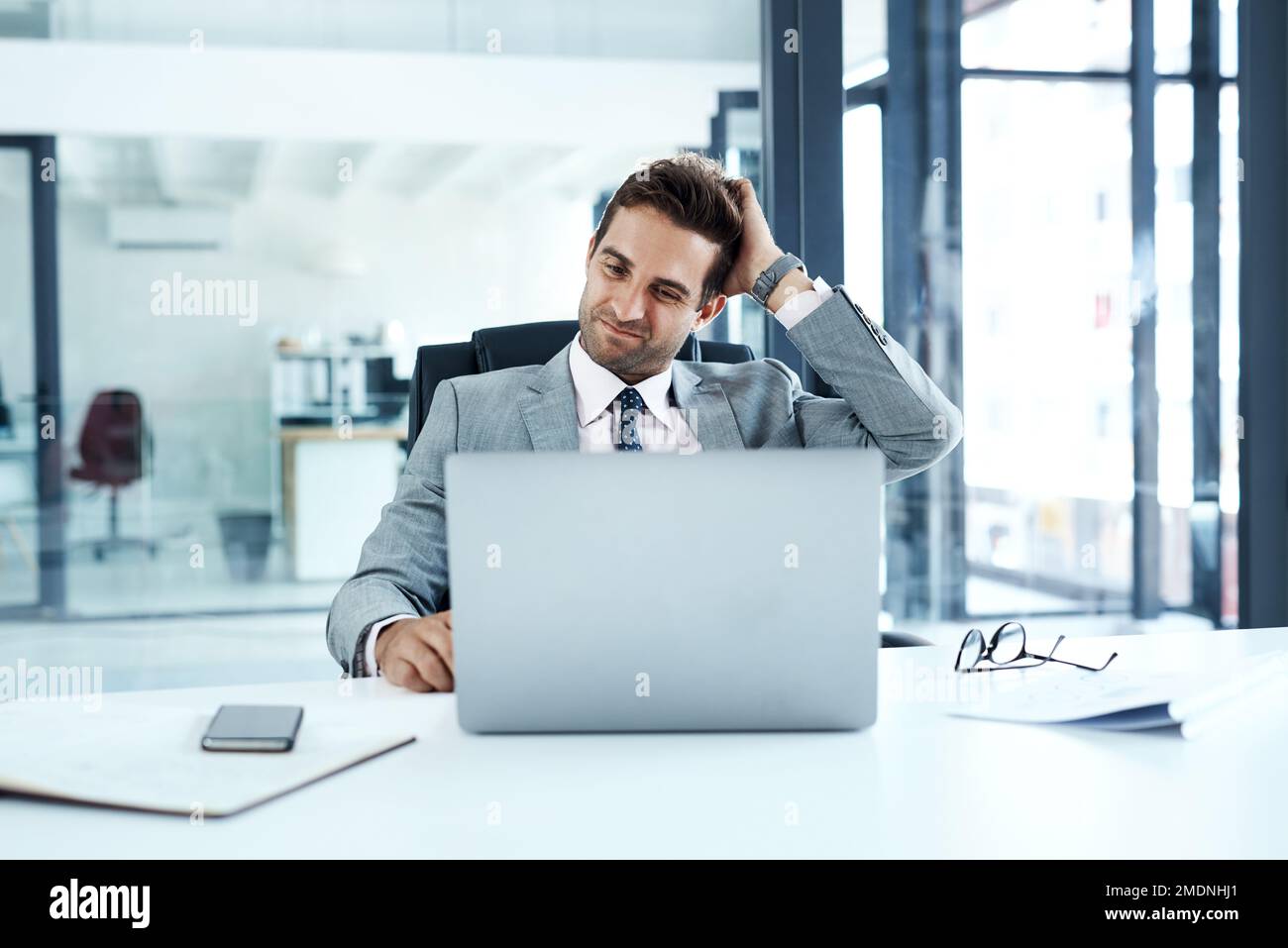 Im not happy until it goes my way. a businessman looking confused while ...