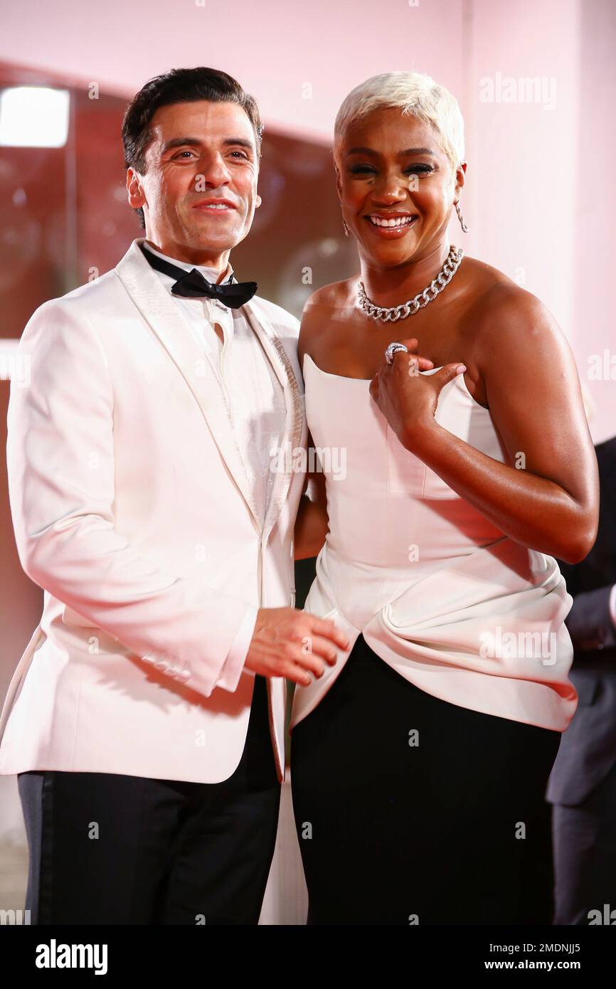 Oscar Isaac, left, and Tiffany Haddish pose for photographers upon ...