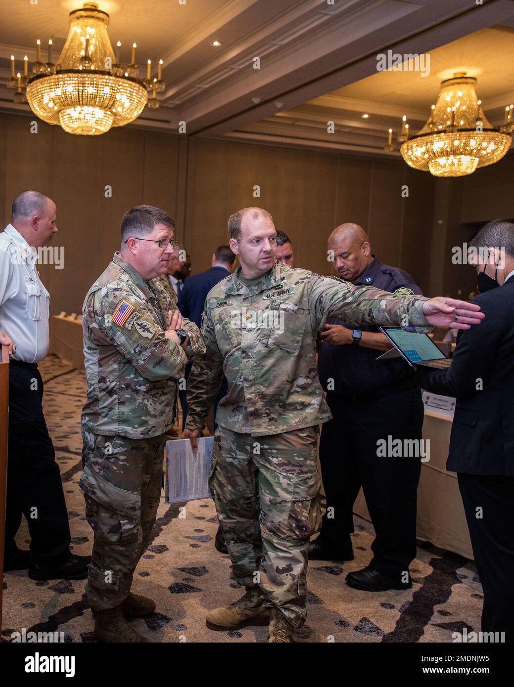 U.S. Army Maj. Simon Caron, right, plans officer, 46th Military Police ...