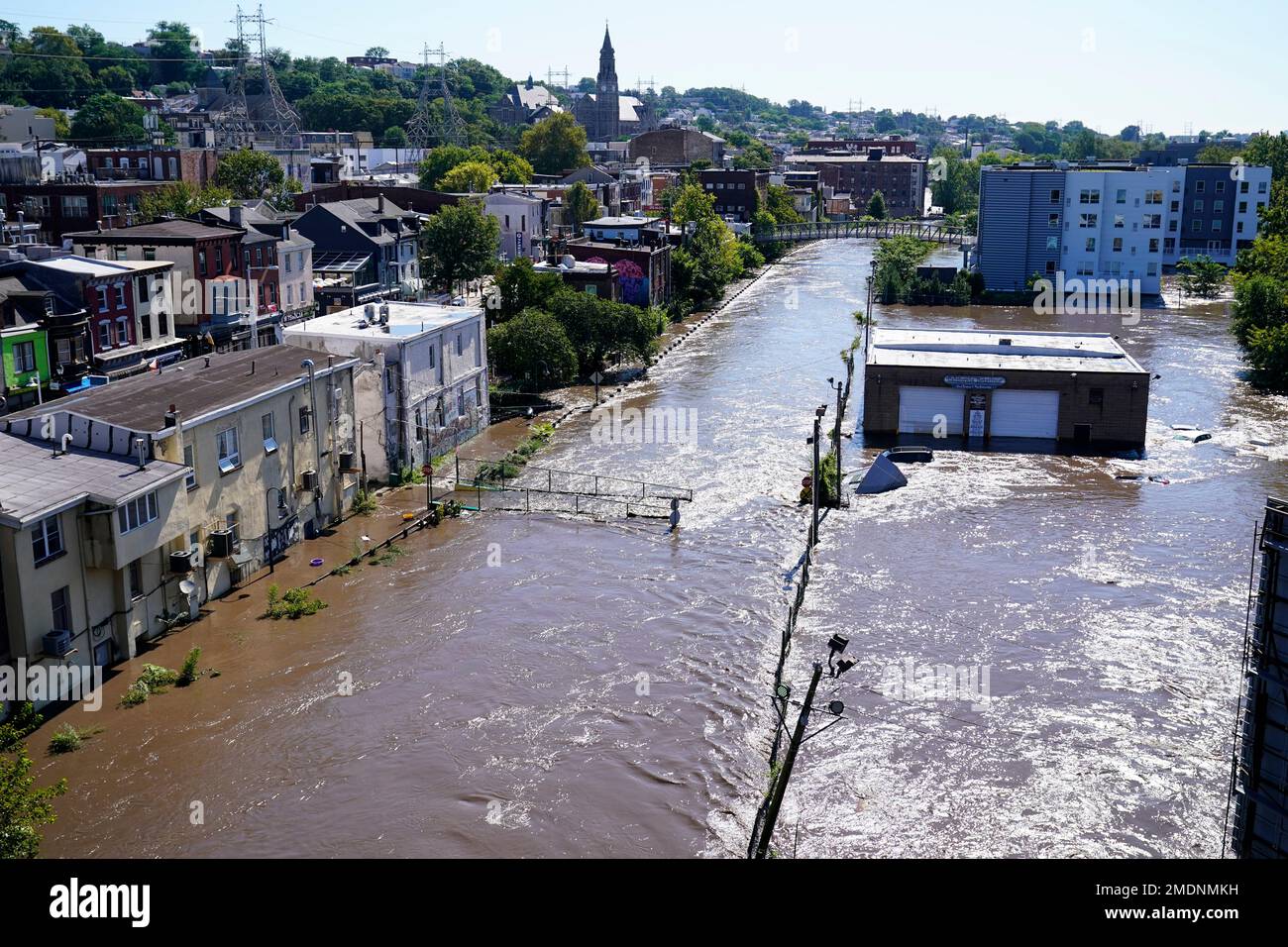 The Schuylkill River exceeds its bank in the Manayunk section of ...