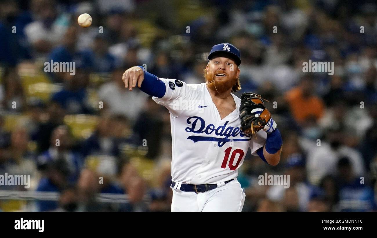 Los Angeles Dodgers third baseman Justin Turner throws to first base ...