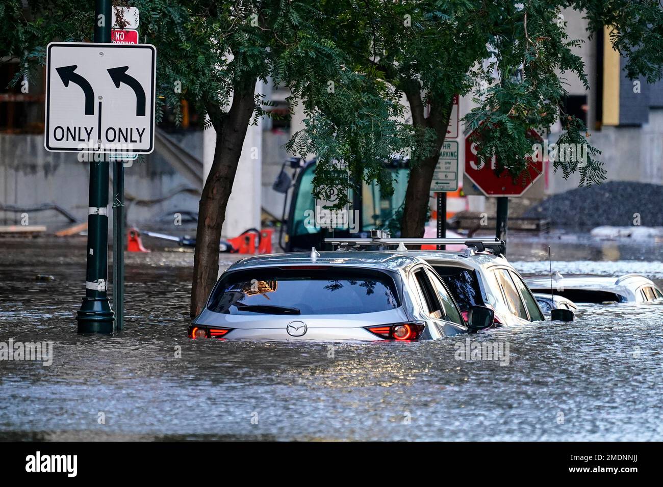 Vehicles are under water during flooding in Philadelphia, Thursday ...