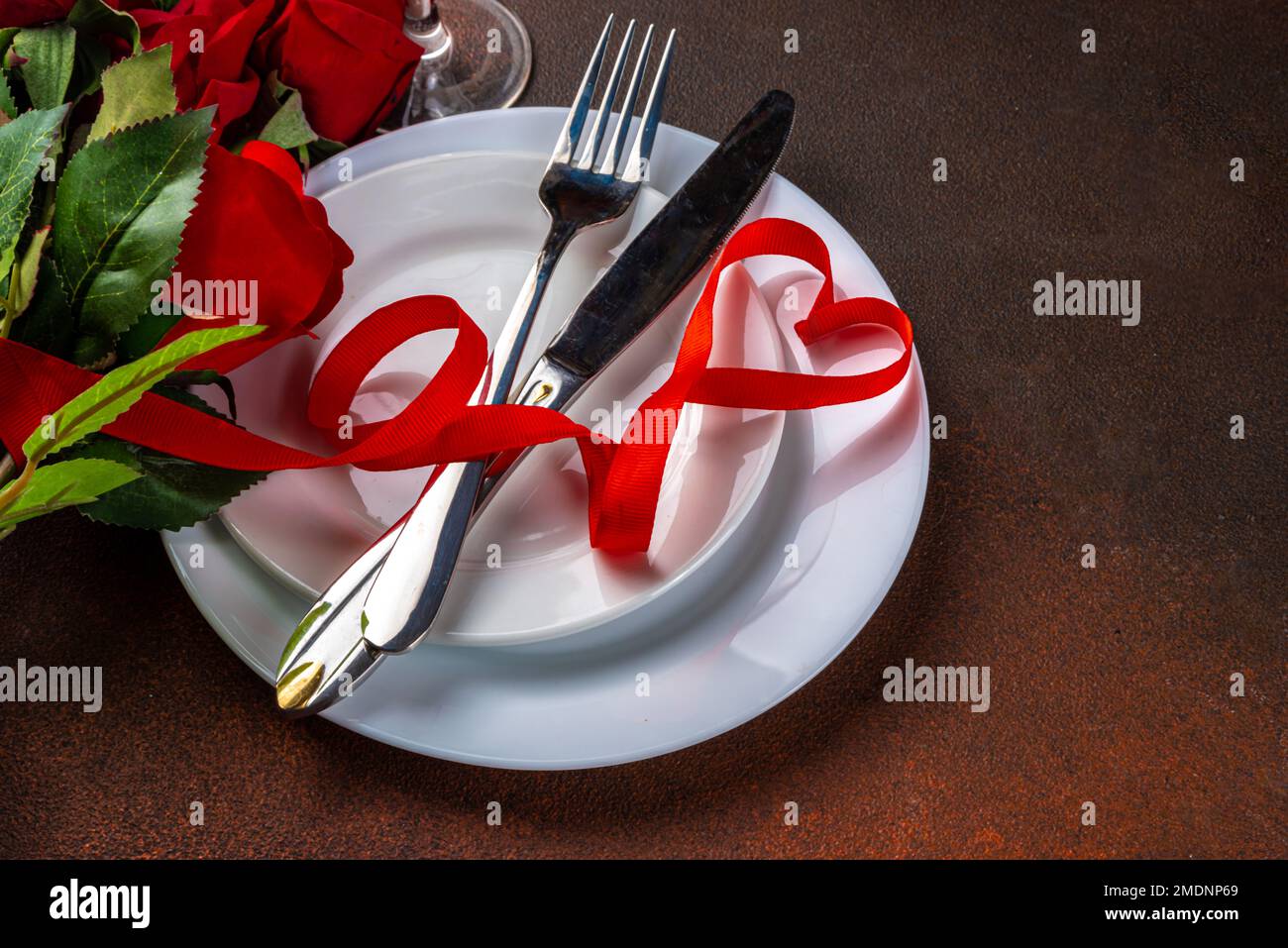 Valentine day table setting on dark background. Romantic diner table ...