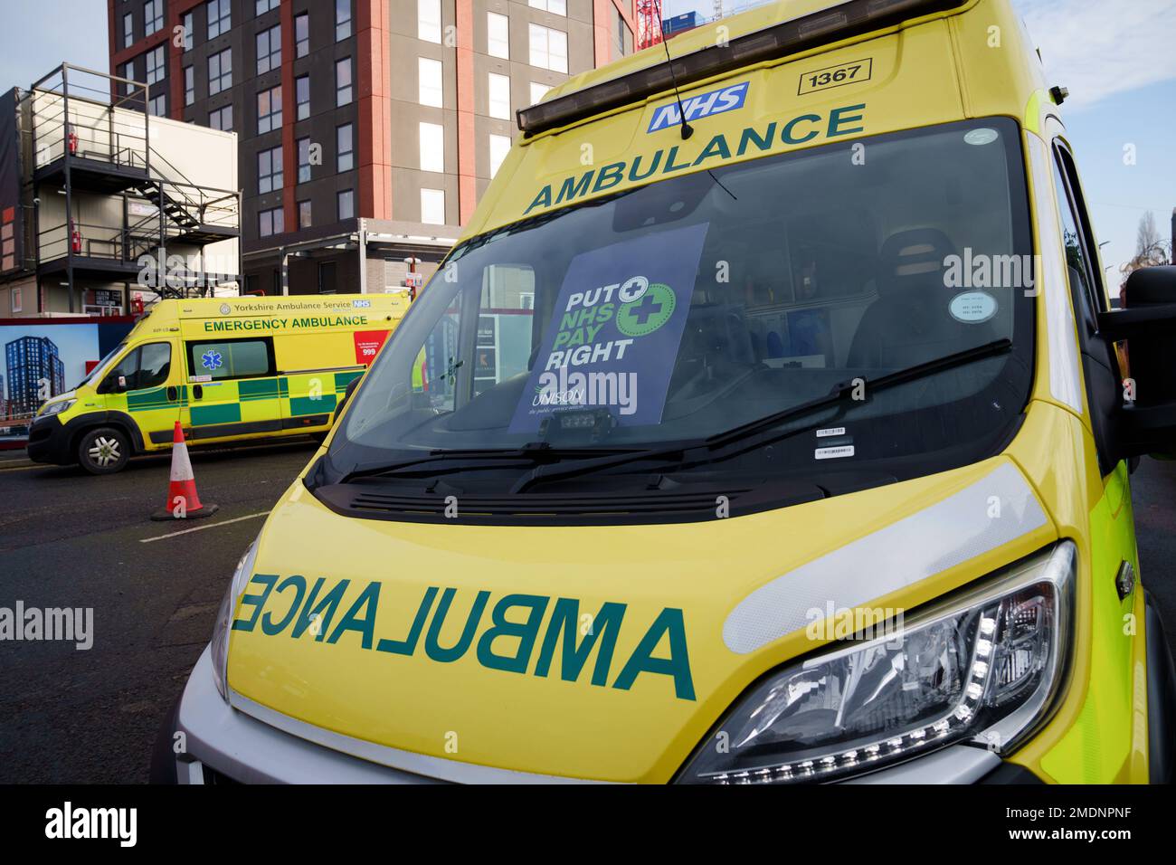 An ambulance with a sign on the dashboard, outside Leeds Ambulance ...