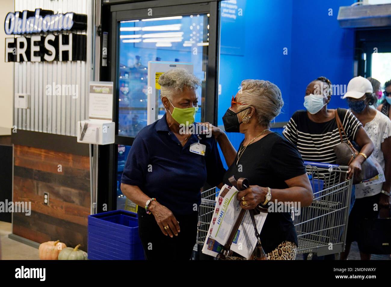 Sandra Steele, right, greets Homeland employee Tricia Anderson, left ...