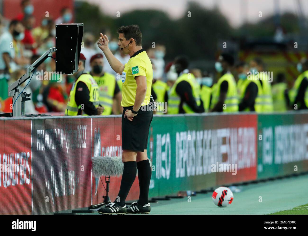 Referee Matej Jug looks at a video screen before awarding a penalty to Portugal during the World ...