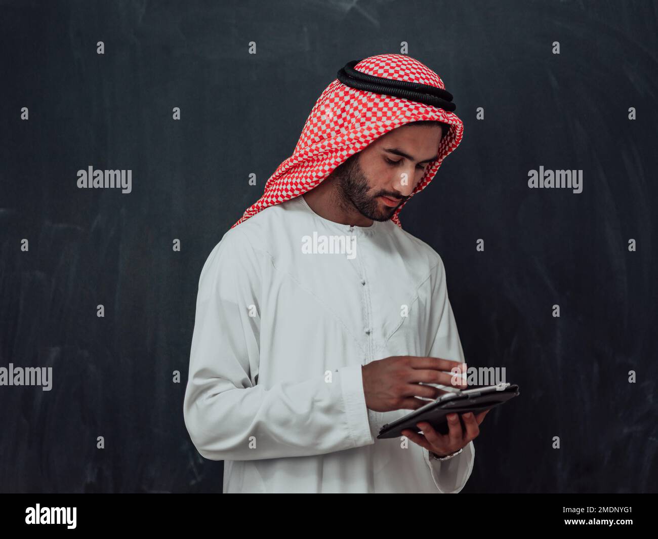 Young arabian muslim businessman using tablet computer wearing hijab ...