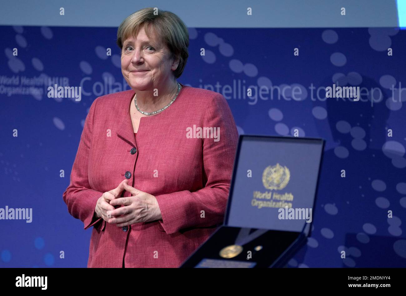German Chancellor Angela Merkel, left, smiles before she receives the ...