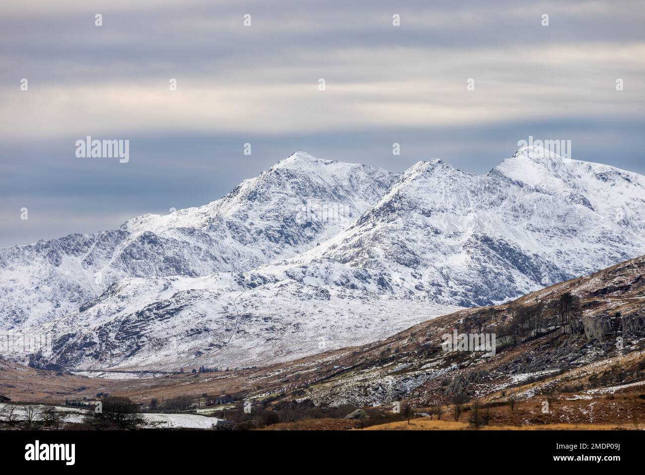 Yr Wyddfa (Snowdon) and Crib Goch under a dusting of snow Stock Photo ...