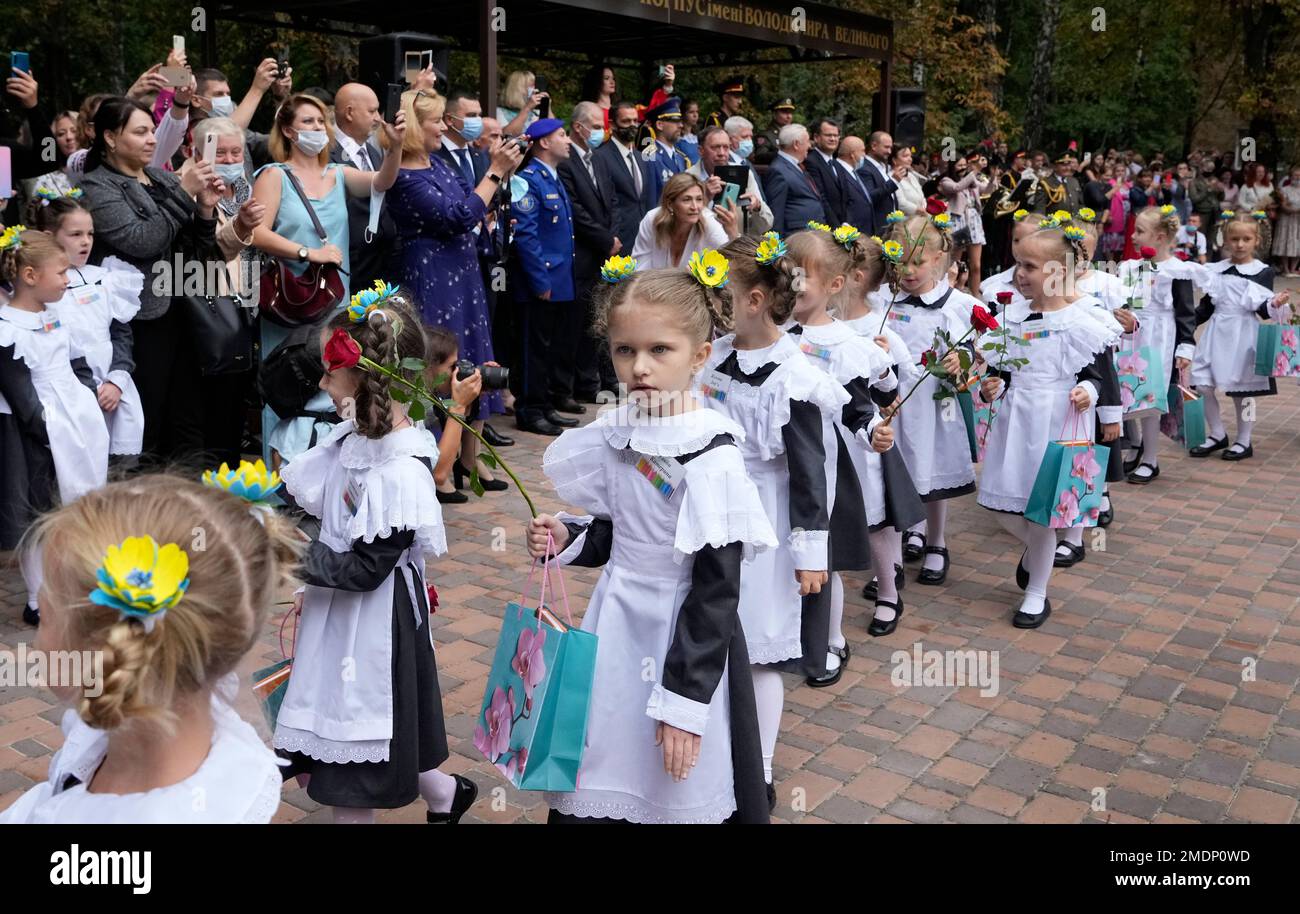 Schoolgirls attend a ceremony on the occasion of the first day of ...