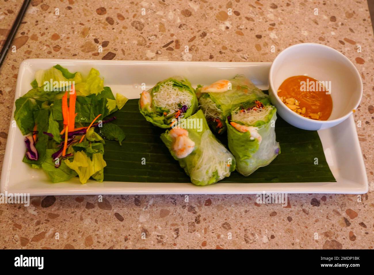 Fresh vietnamese spring rolls with peanut butter sauce for dipping ...