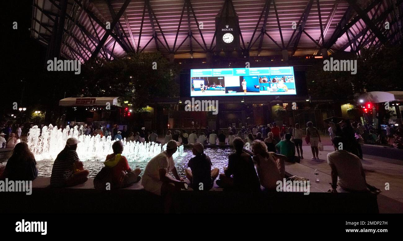 Fans watch tennis action on screens outside Arthur Ashe Stadium at the ...