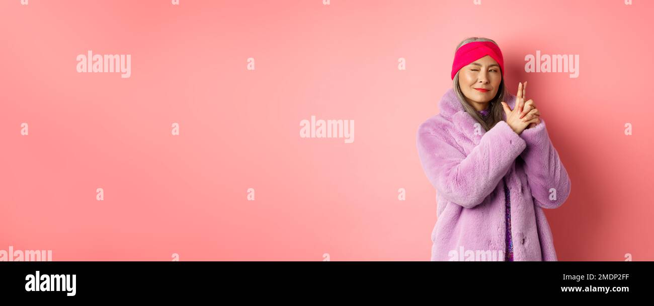 Fashion and shopping concept. Cool and stylish asian senior lady in ...