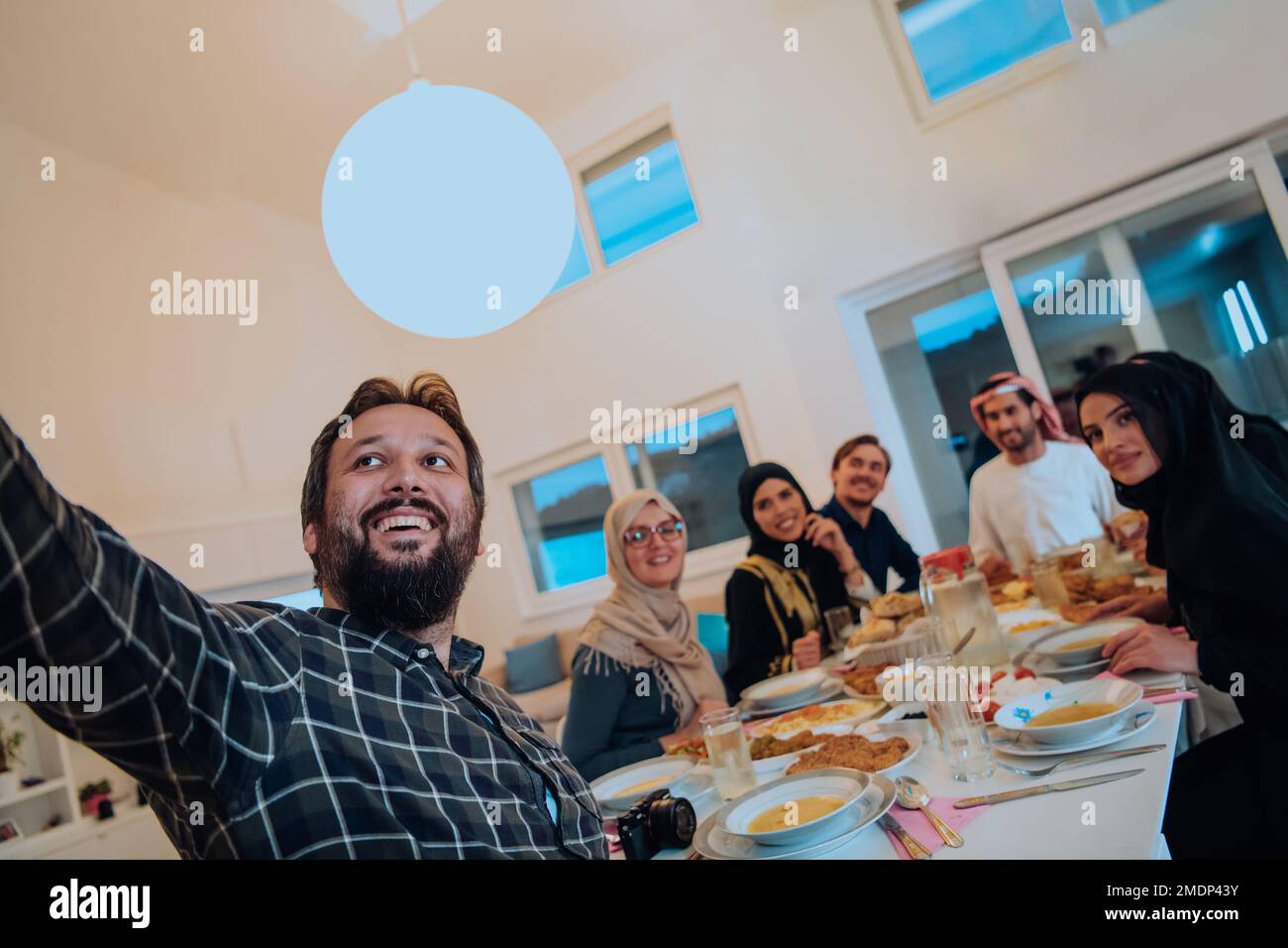 Eid Mubarak Muslim family having Iftar dinner taking pictures with ...