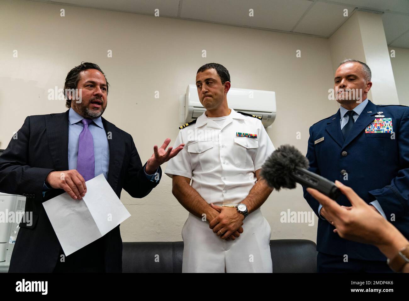 Attorneys Brian Bouffard, left, accompanied by U.S. Navy Lt. Cmdr ...
