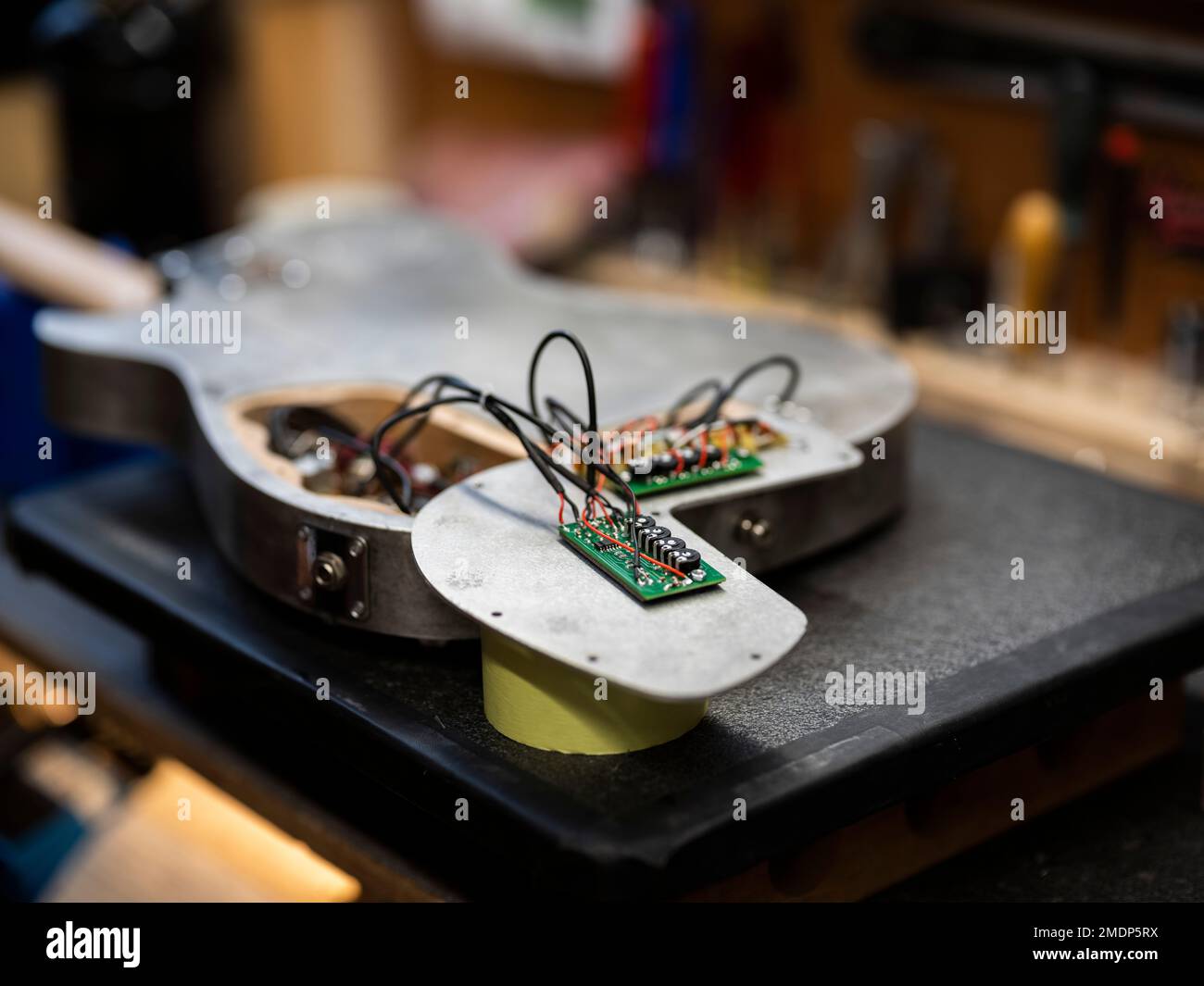 Manson Guitar Works Matt Bellamy DL-0R electric guitar on a work bench ...