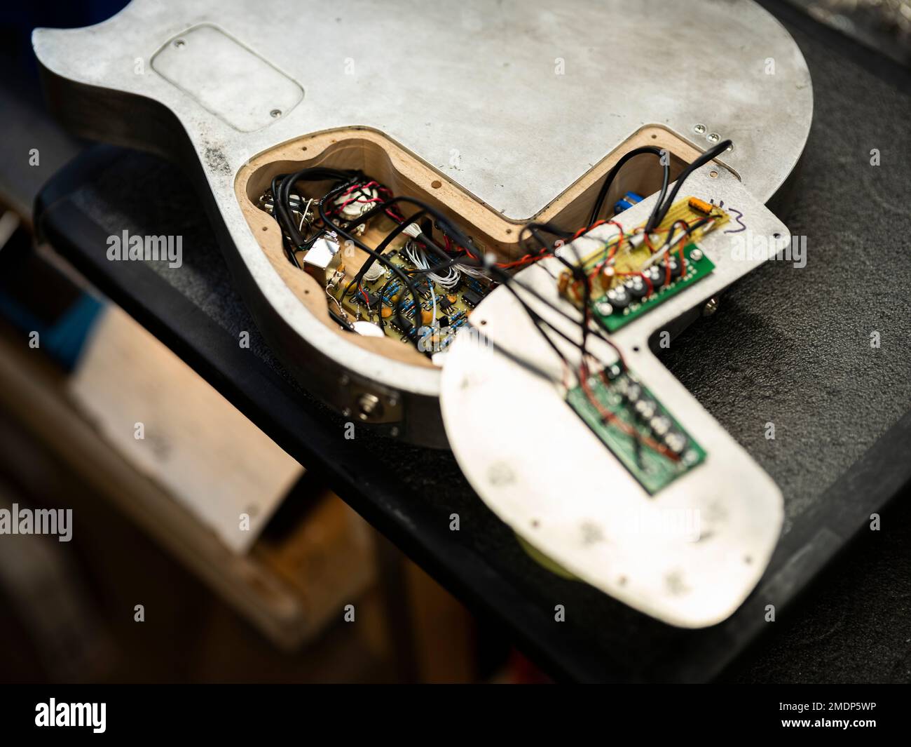 Manson Guitar Works Matt Bellamy DL-0R electric guitar on a work bench ...