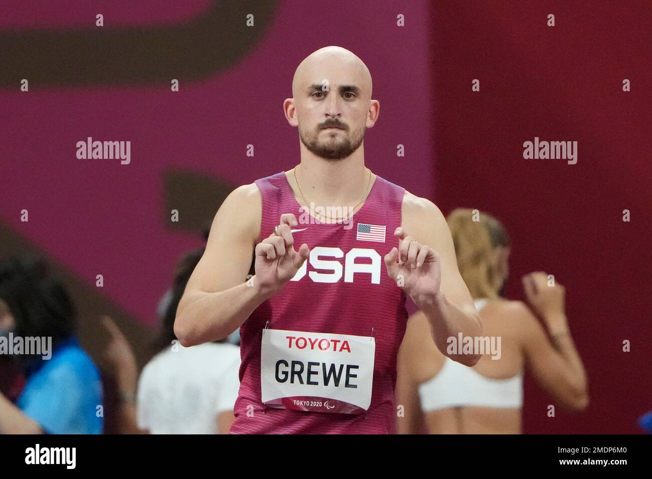 Sam Grewe of the United States gestures as he warms up before the men's ...